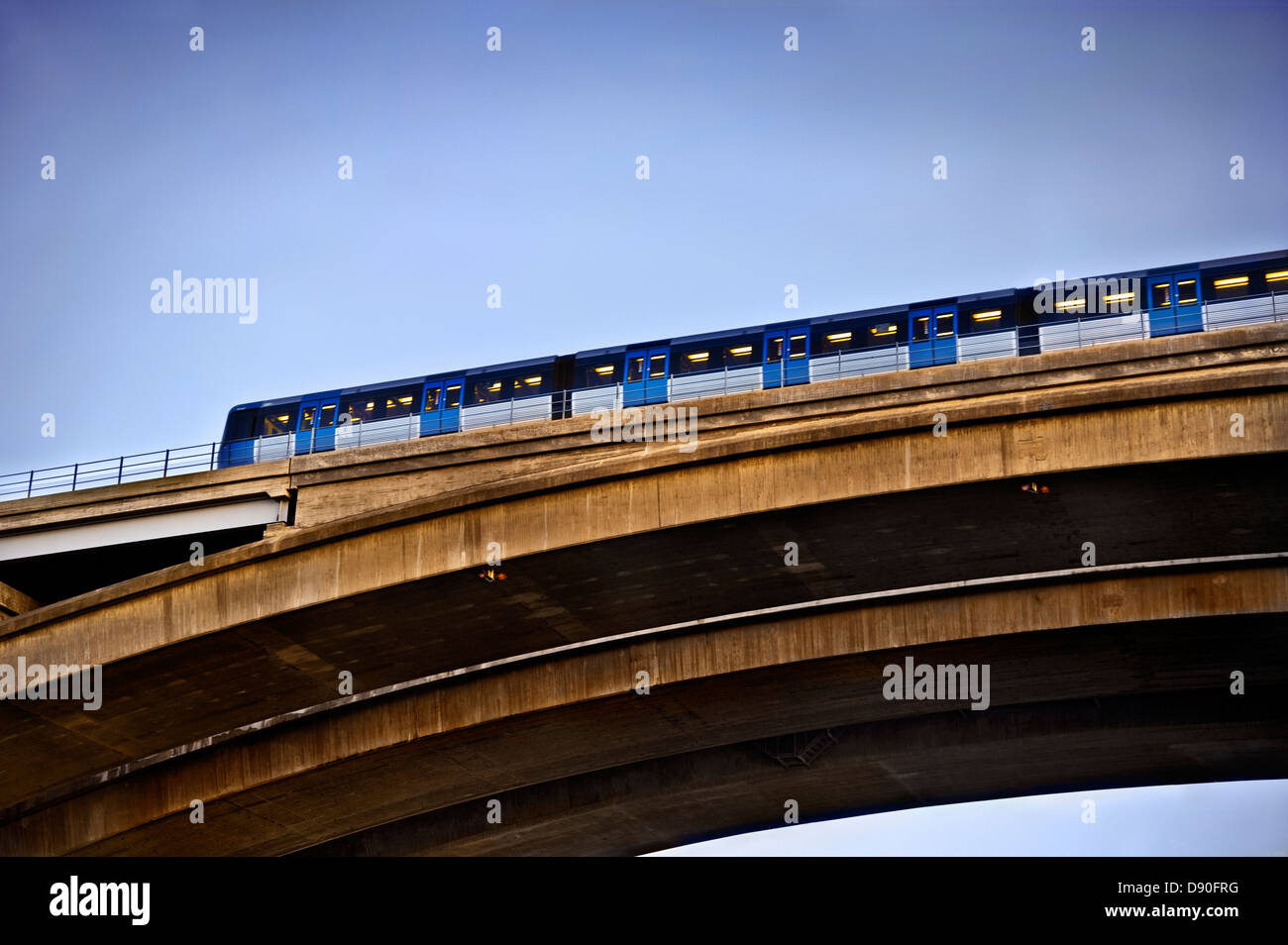Metro train on bridge Stock Photo - Alamy