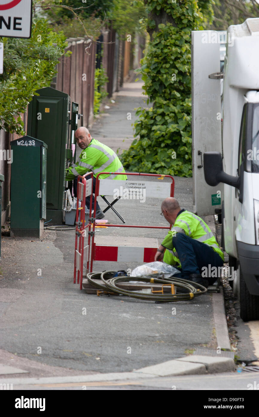 British telecom engineers working in street on domestic telephone ... British telecom engineers working in street on domestic telephone ...