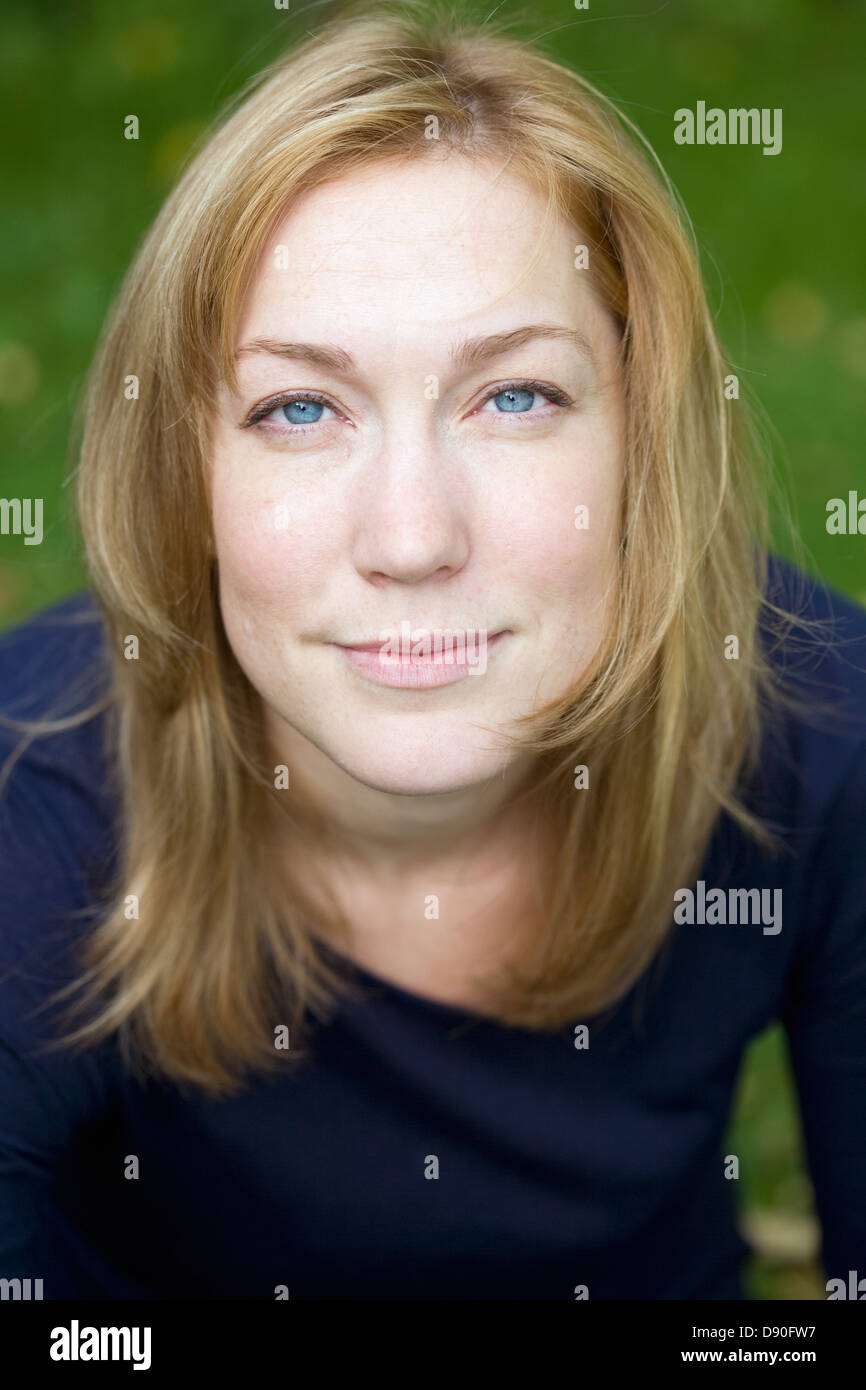 Mid adult woman smiling Stock Photo - Alamy