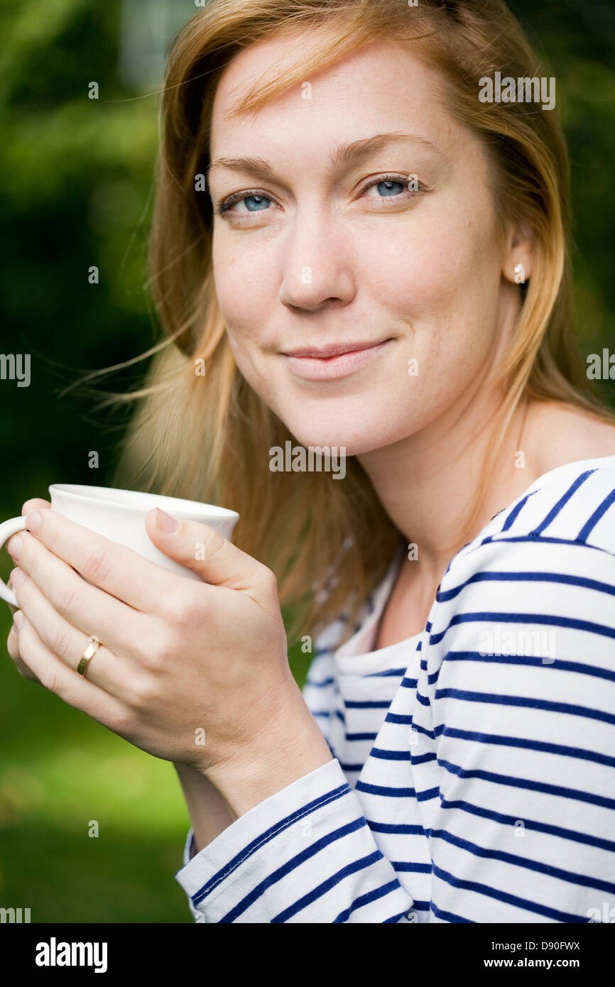 Woman Holding Coffee Cup at Shanita Matheny blog