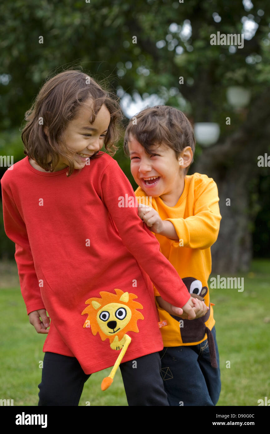 Brother and sister messing about Stock Photo - Alamy