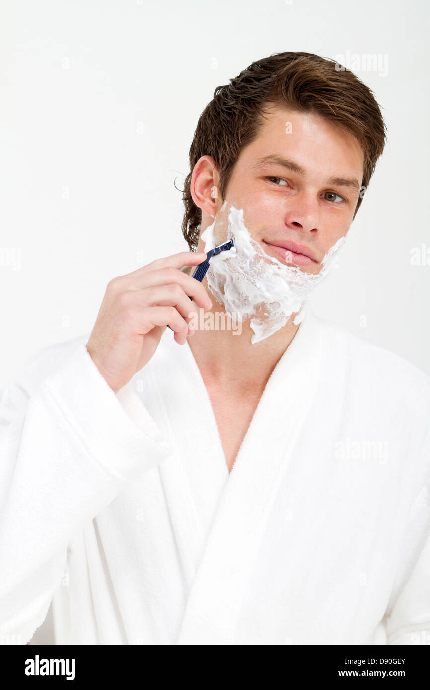 handsome young man shaving in morning Stock Photo - Alamy