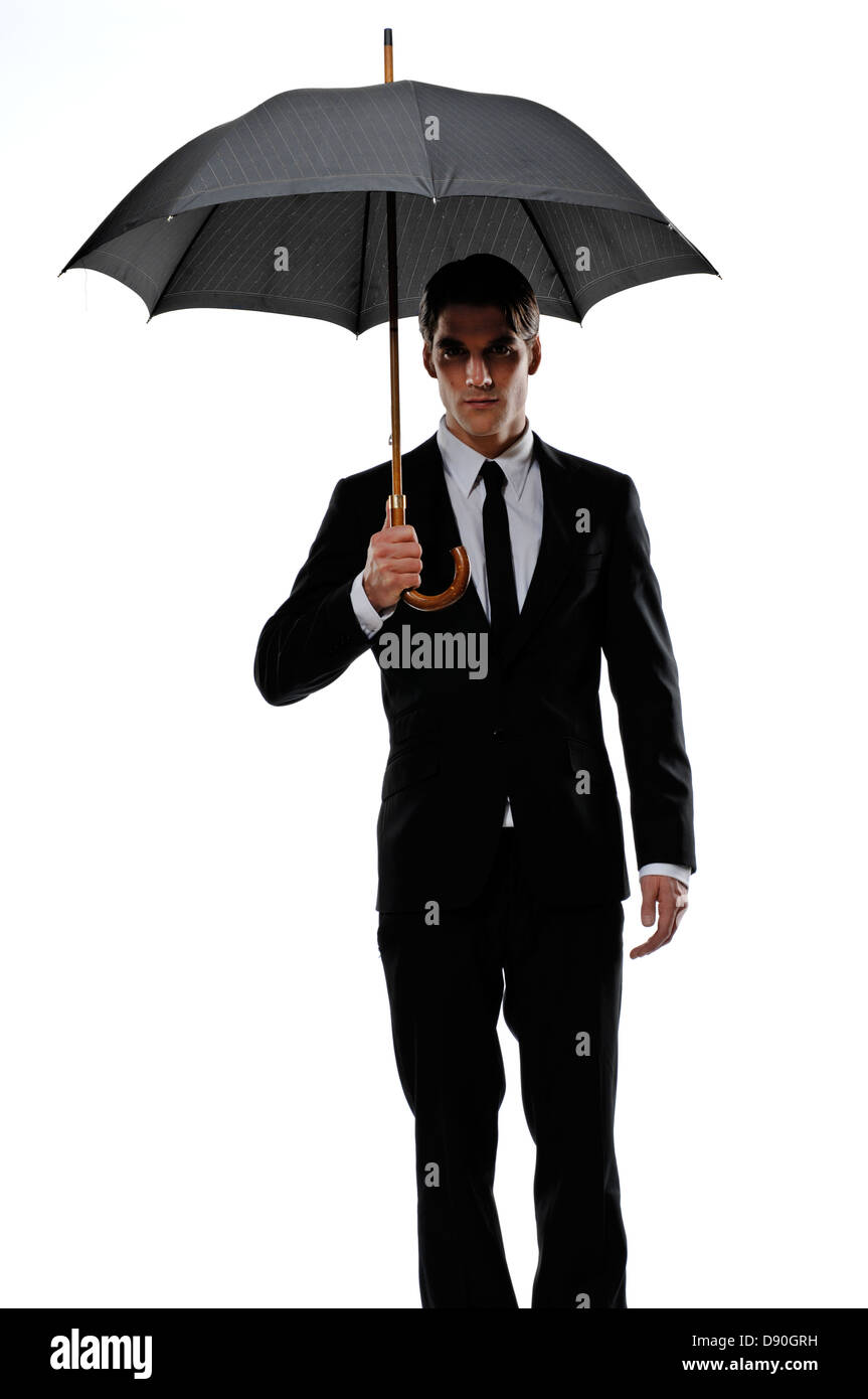 A man holding an umbrella Stock Photo - Alamy