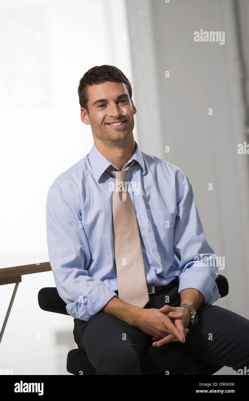 Portrait of a smiling man in an office Stock Photo - Alamy