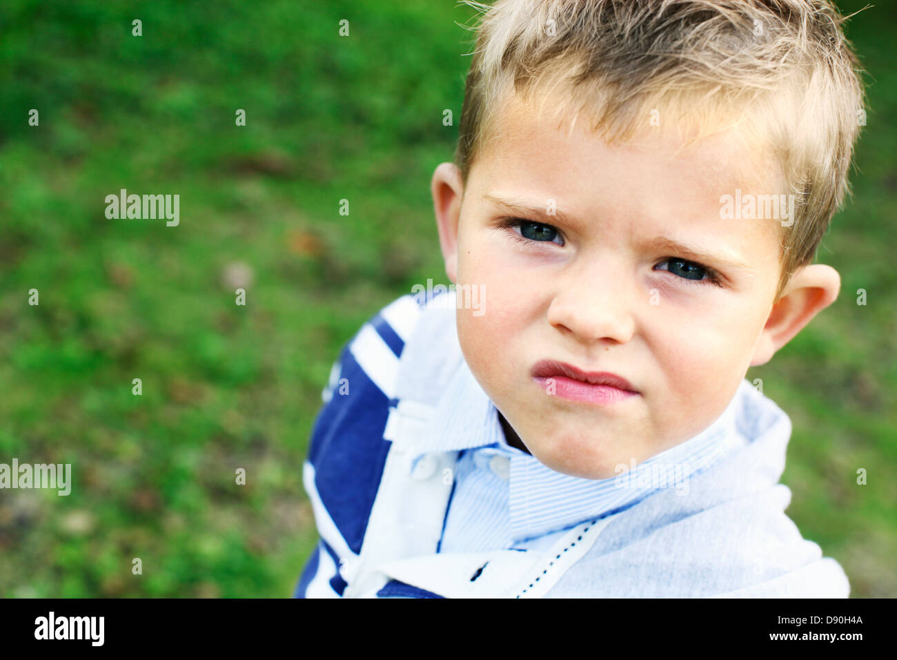 Scowling boy hi-res stock photography and images - Alamy