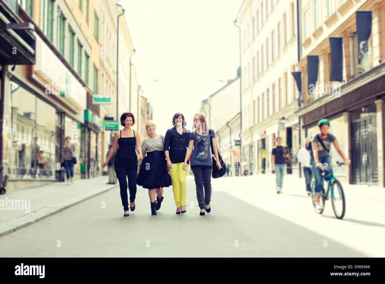 Friends walking together Stock Photo - Alamy