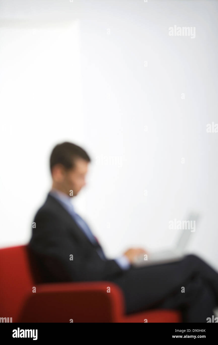 A man with a computer in an office Stock Photo - Alamy