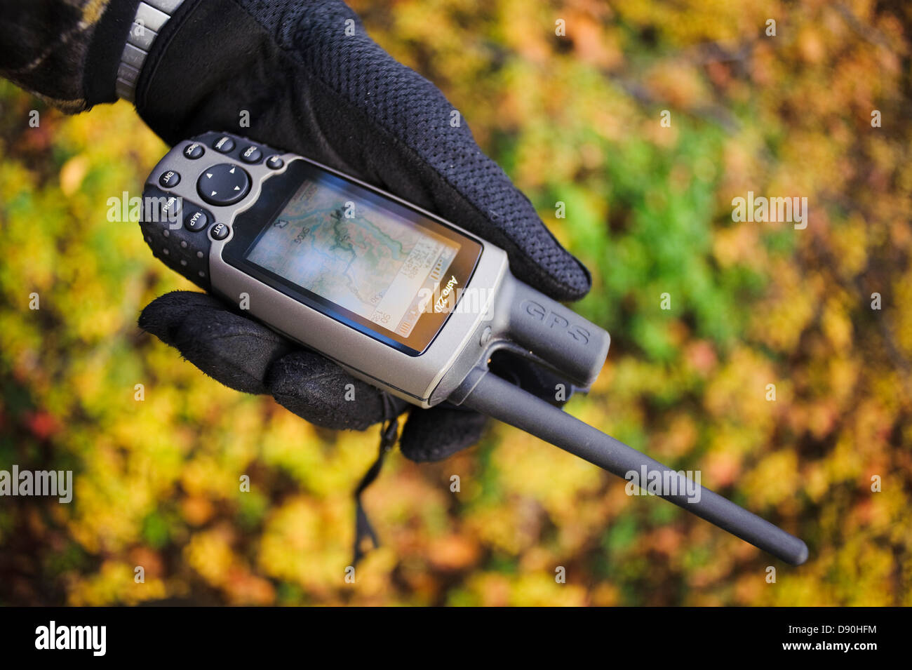 Human hand holding GPS Stock Photo - Alamy