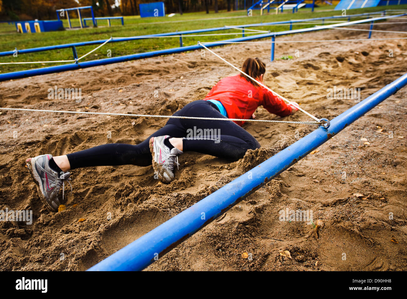 Woman crawling on ground Stock Photo - Alamy