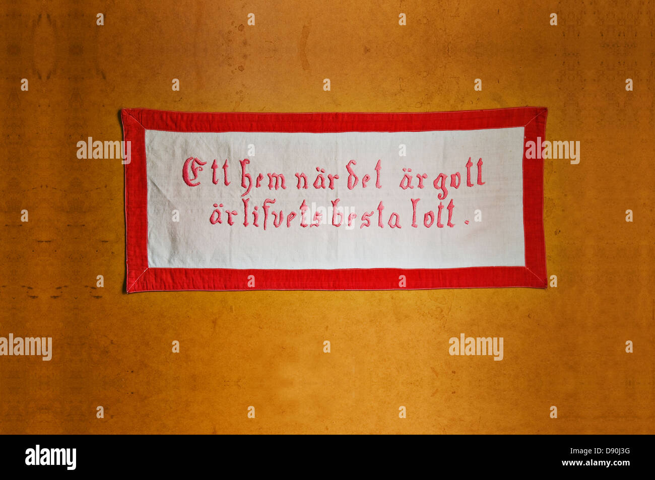Embroidered message on a wall hanging, Sweden Stock Photo - Alamy