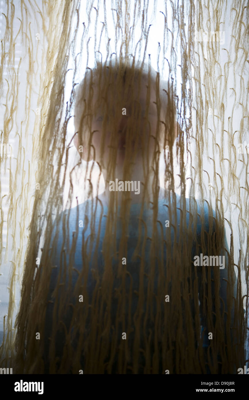 Boy behind a curtain hi-res stock photography and images - Alamy