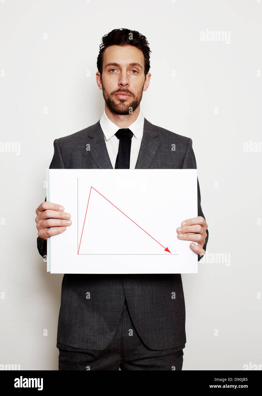 Man standing and holding graph, portrait Stock Photo - Alamy