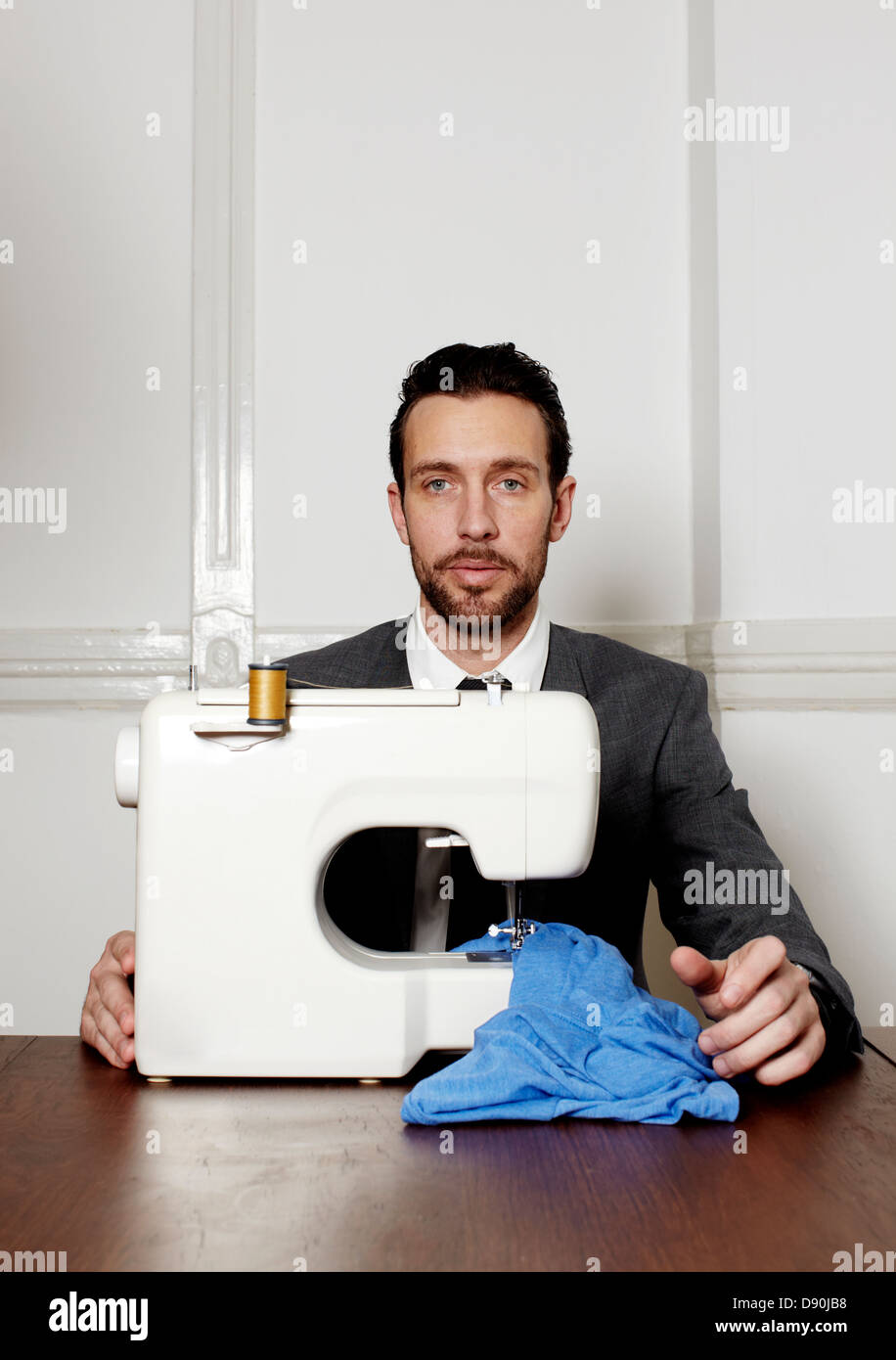 Man working on sewing machine Stock Photo - Alamy