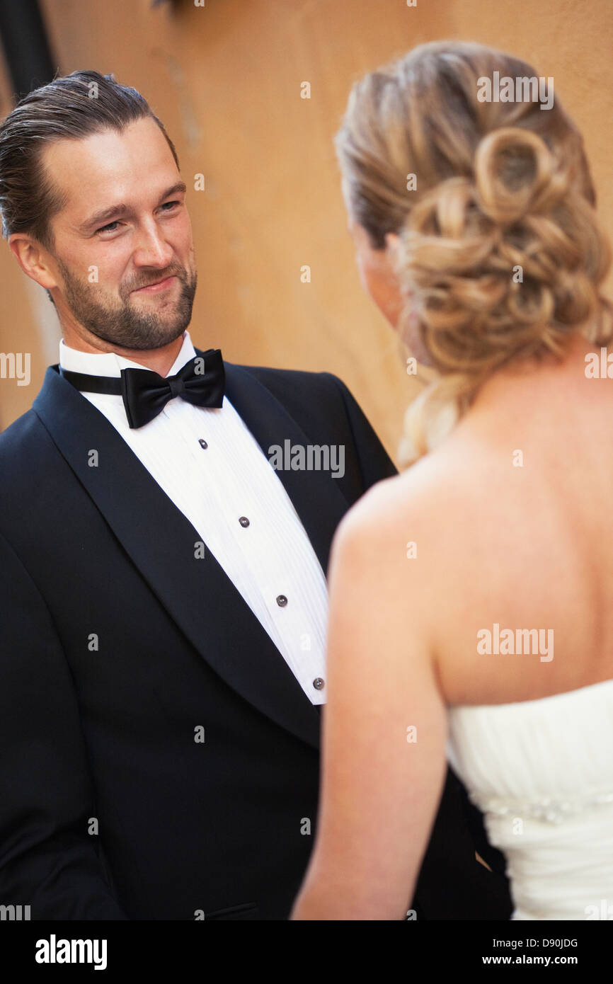 Groom and bride standing face to face Stock Photo - Alamy