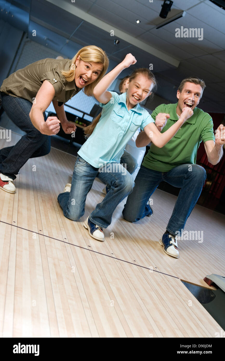 Family in a bowling alley Stock Photo - Alamy
