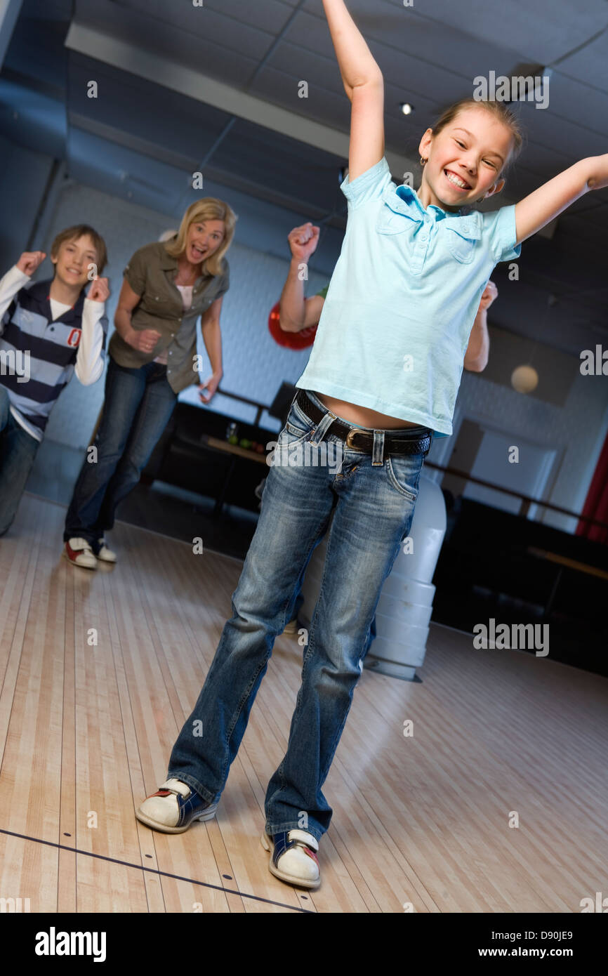 Girl cheering after a strike Stock Photo - Alamy