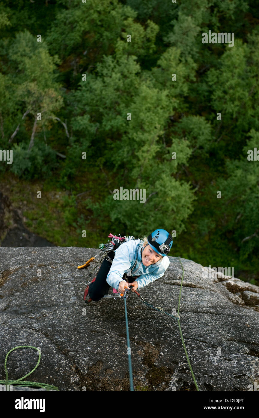 Woman climbing mountain Stock Photo - Alamy
