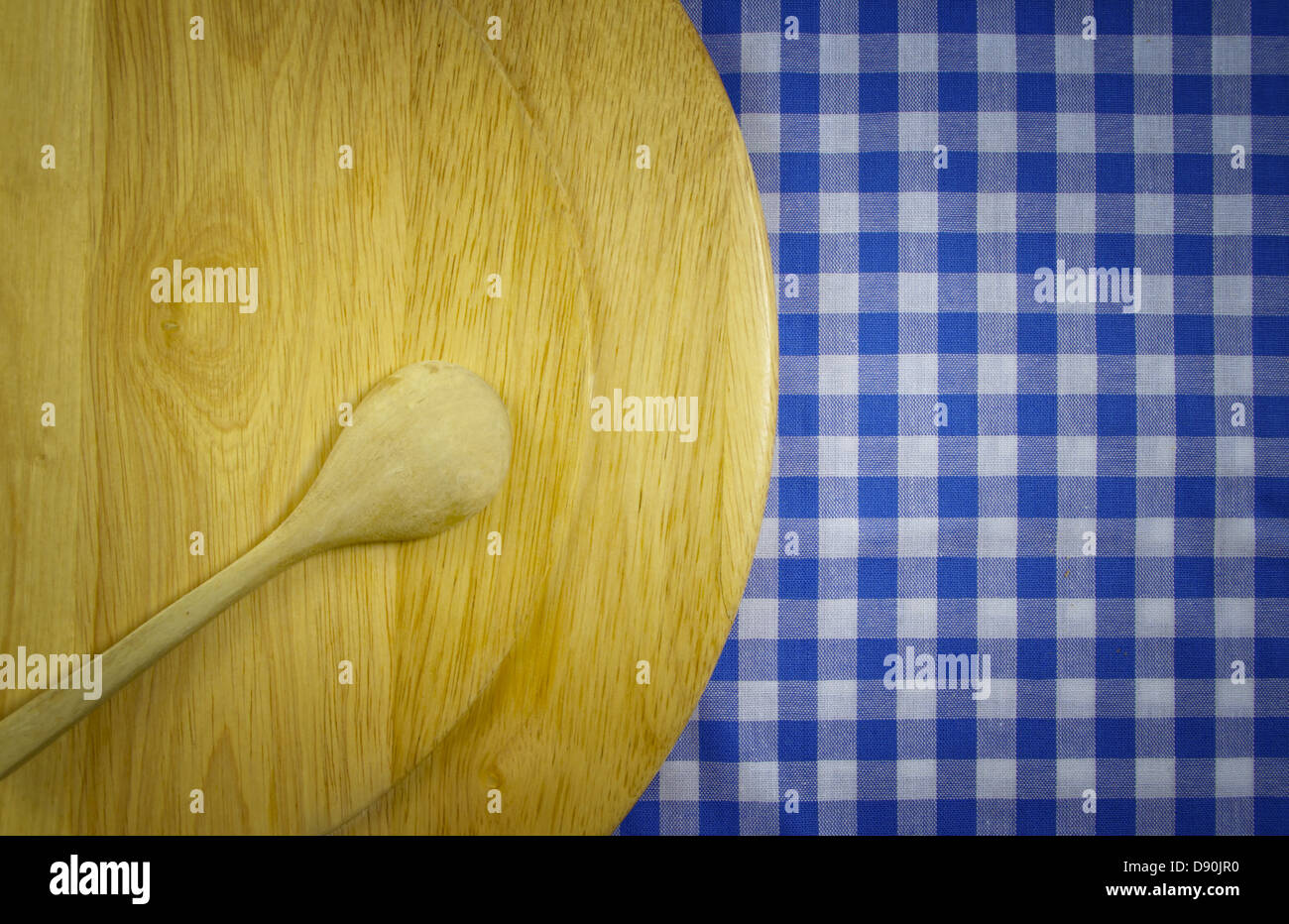 White and blue kitchen textile texture, wooden spoon on wood textured ...