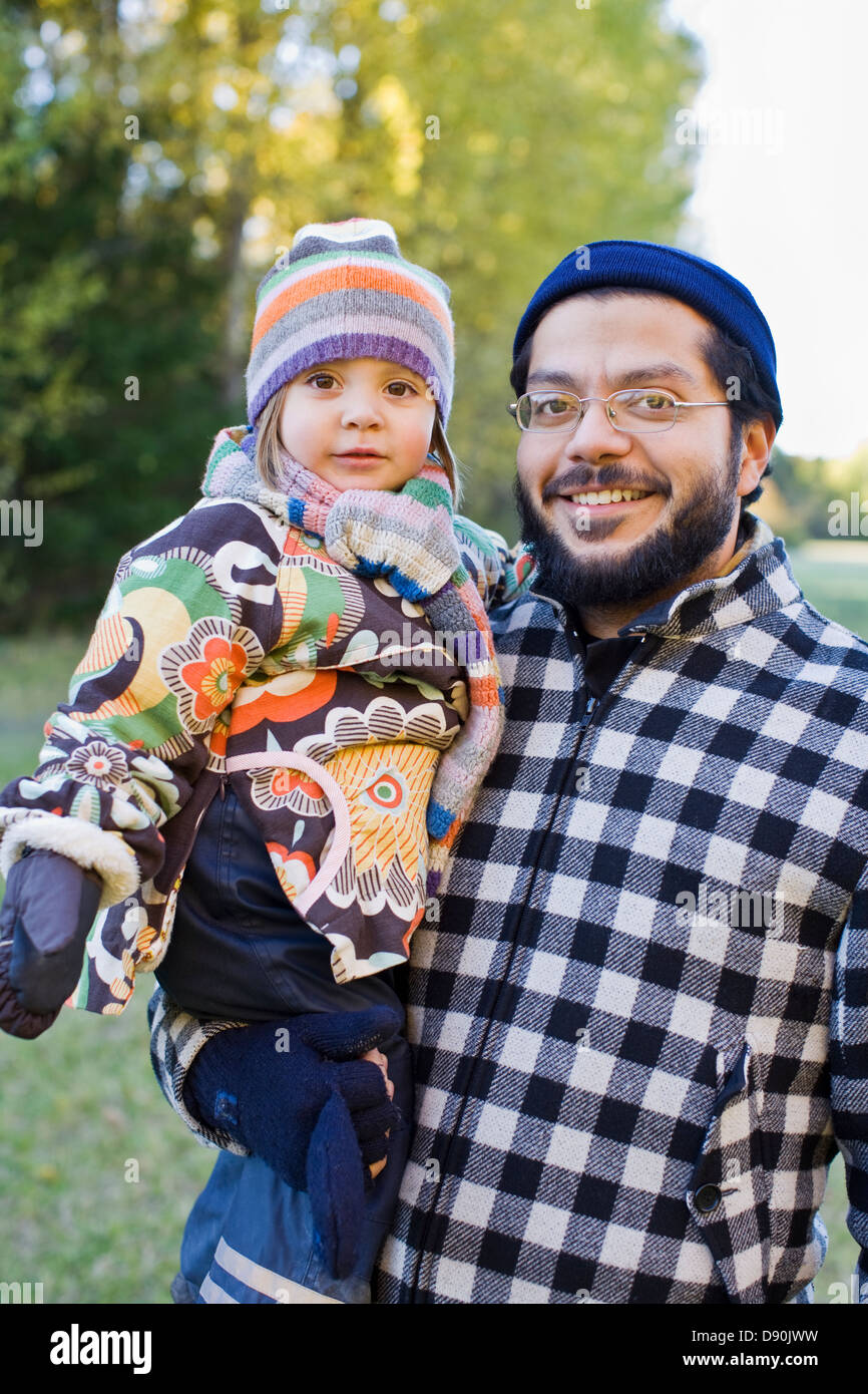 Father and daughter smiling to camera Stock Photo - Alamy