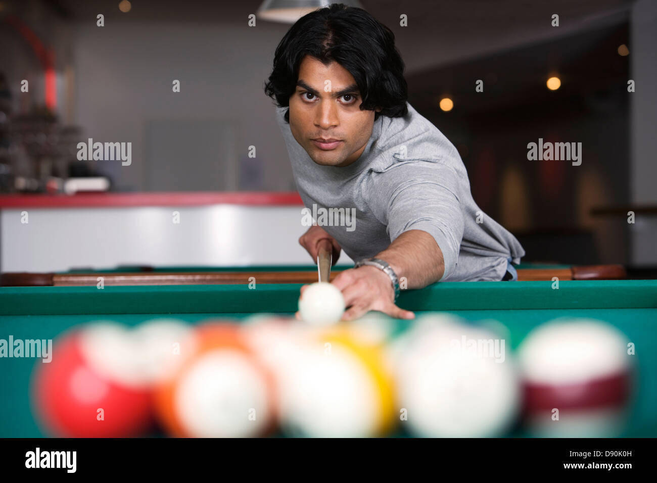 A man playing pool Stock Photo - Alamy