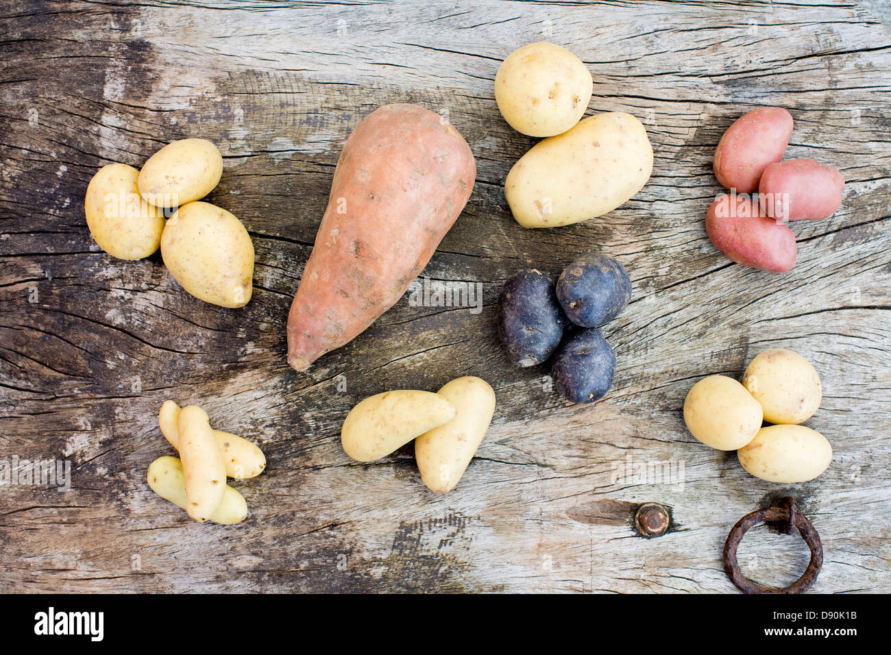 Variety of potatoes on wood grain Stock Photo - Alamy