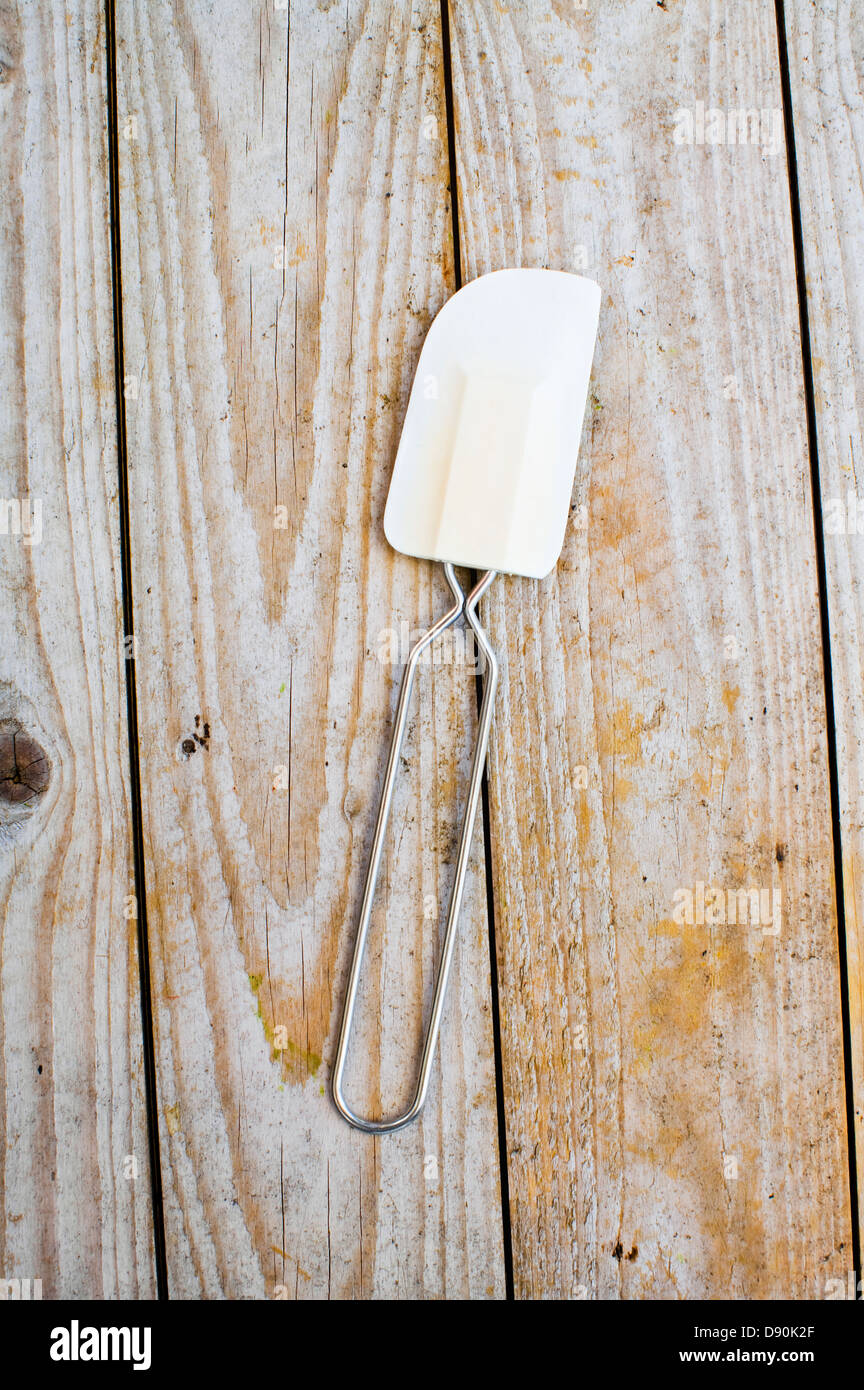 Spatula on hardwood floor Stock Photo - Alamy