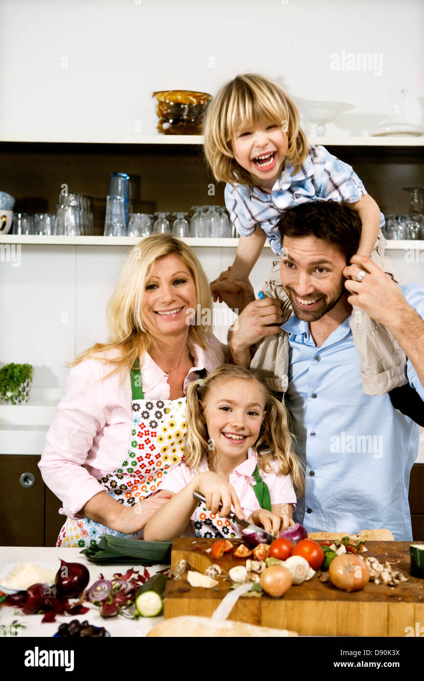 A family cooking dinner together Stock Photo - Alamy