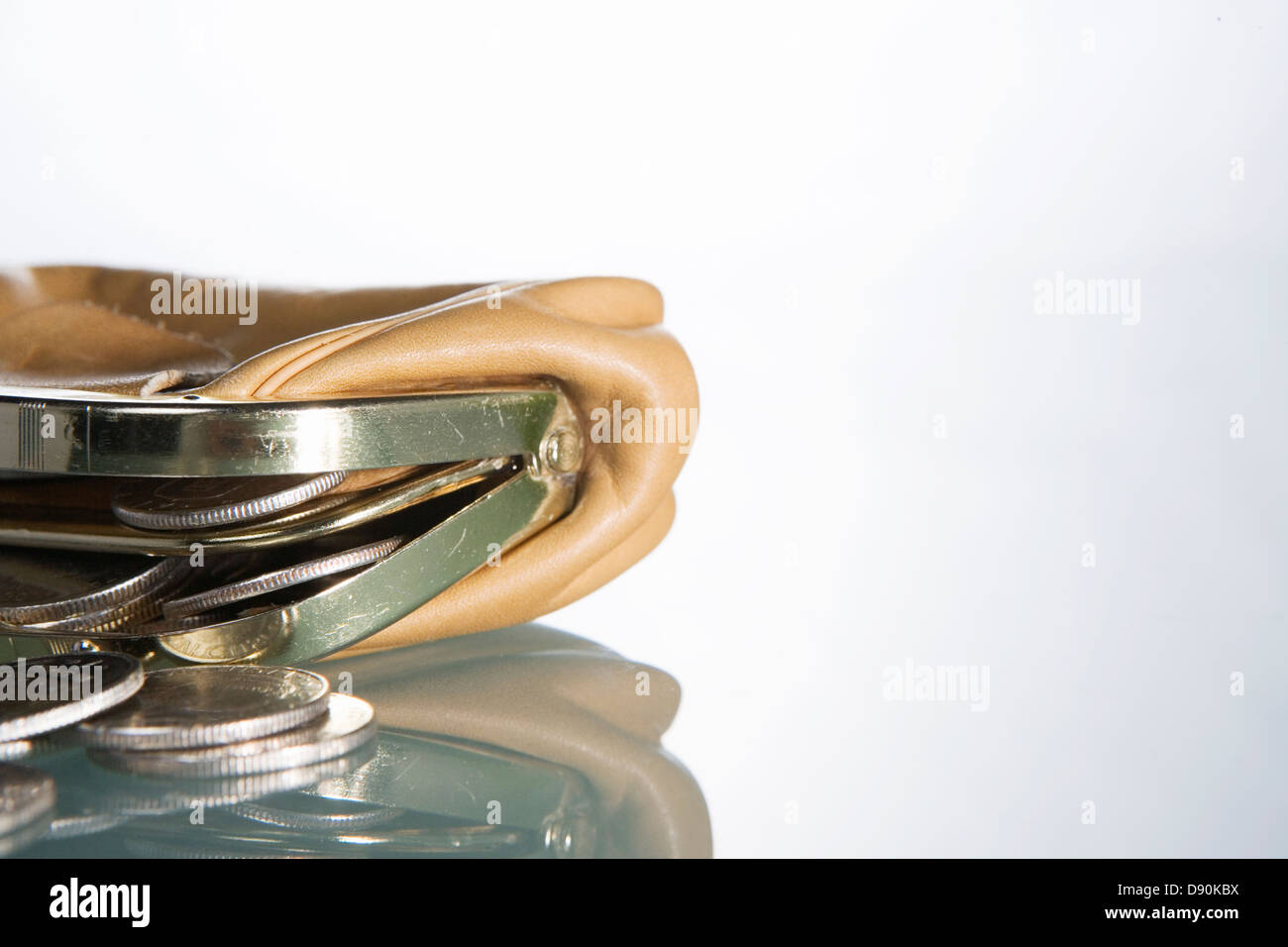 Coins in a wallet Stock Photo - Alamy