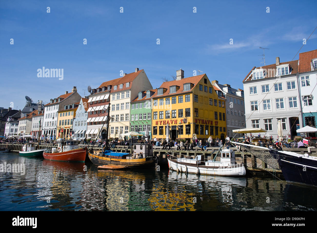 Small boats at waterfront Stock Photo - Alamy