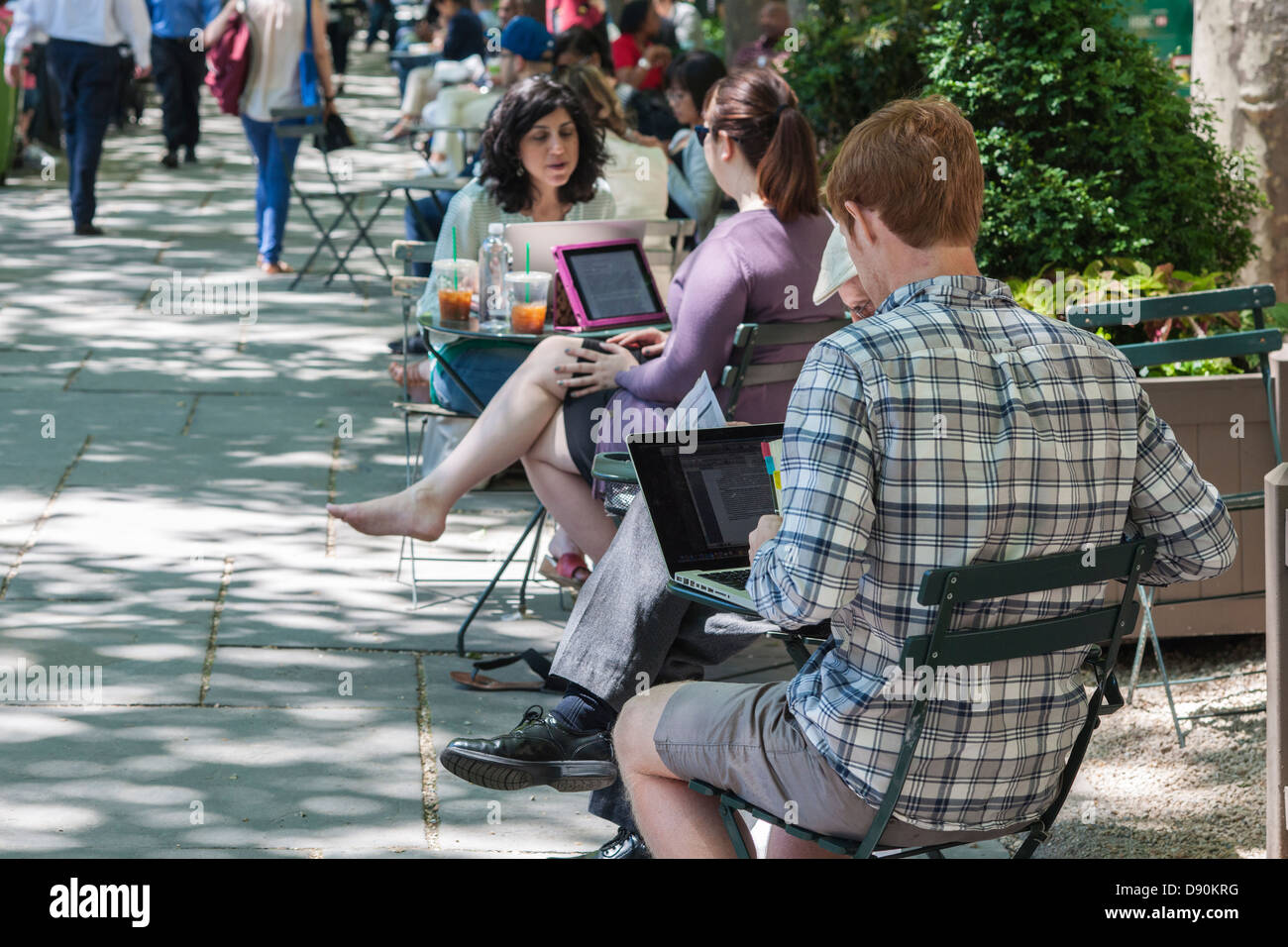 Visitors to Bryant Park in New York use their laptop computers on ...