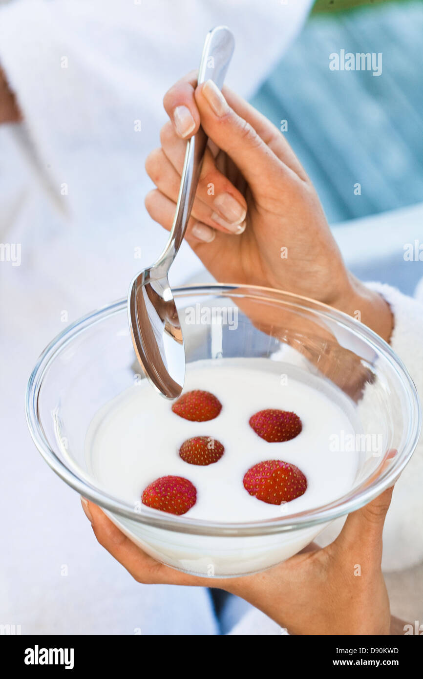 Womans hands holding bowl of breakfast Stock Photo - Alamy