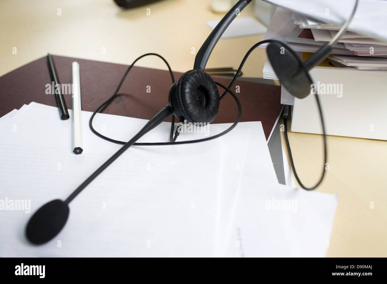A headset on a desk in an office Stock Photo - Alamy