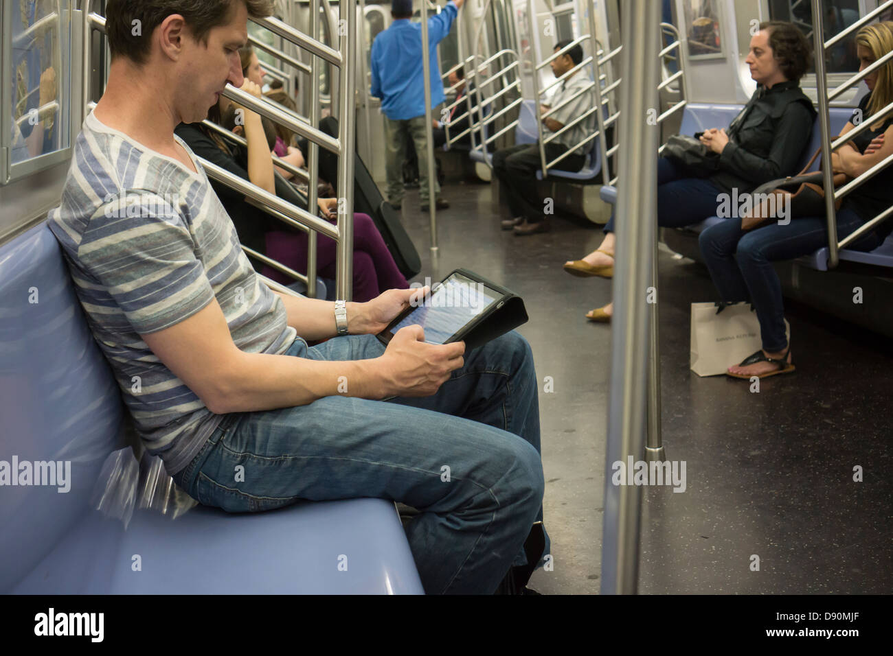 New york city busy subway car hi-res stock photography and images - Alamy