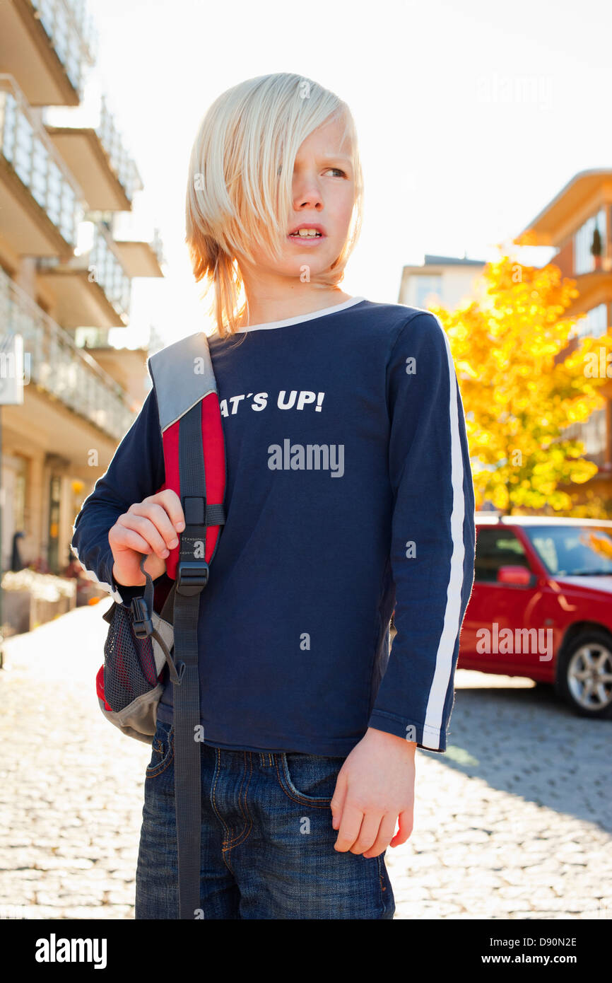Portrait of schoolboy on street Stock Photo - Alamy