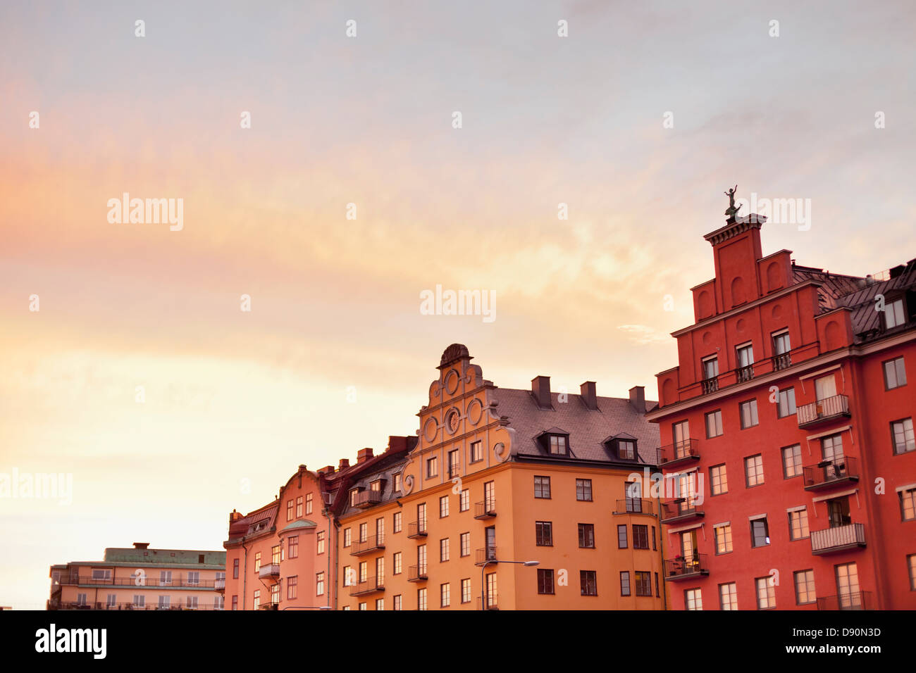 Apartment buildings at sunset Stock Photo - Alamy