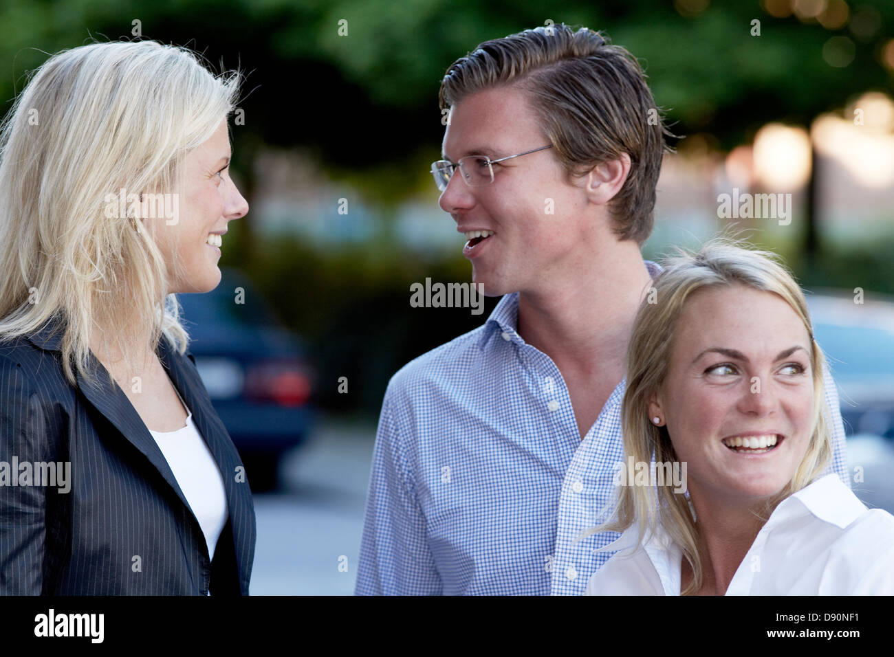 Three friends talking, Sweden Stock Photo - Alamy
