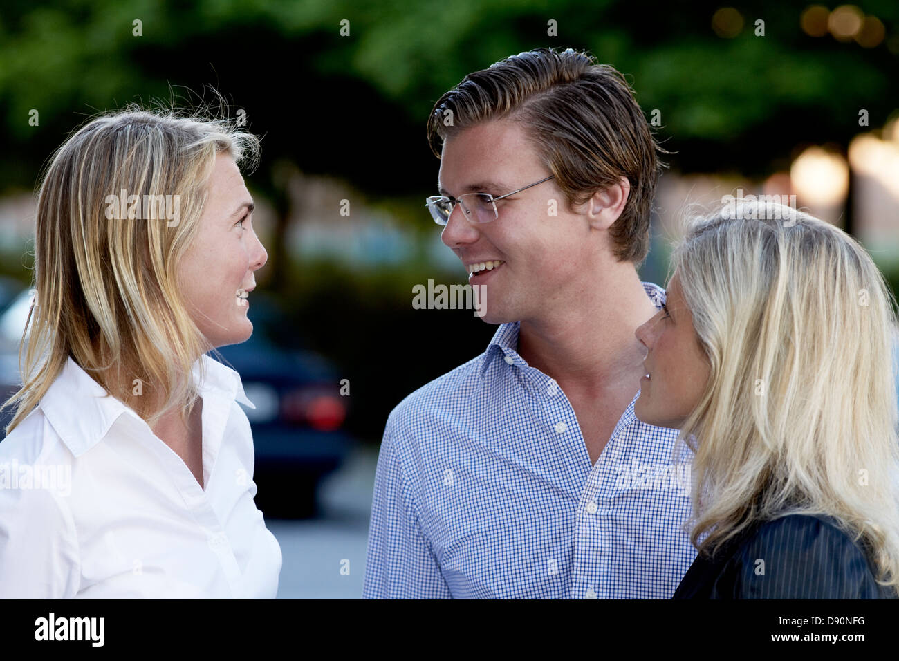Three friends talking, Sweden Stock Photo - Alamy