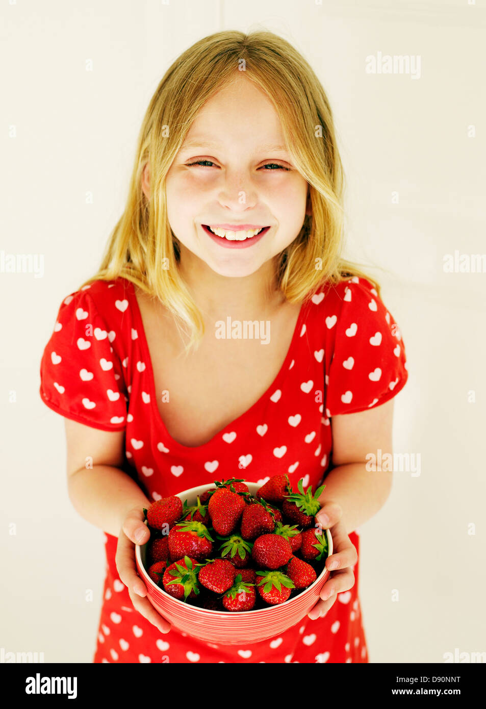 Girl eating strawberries, Sweden Stock Photo - Alamy