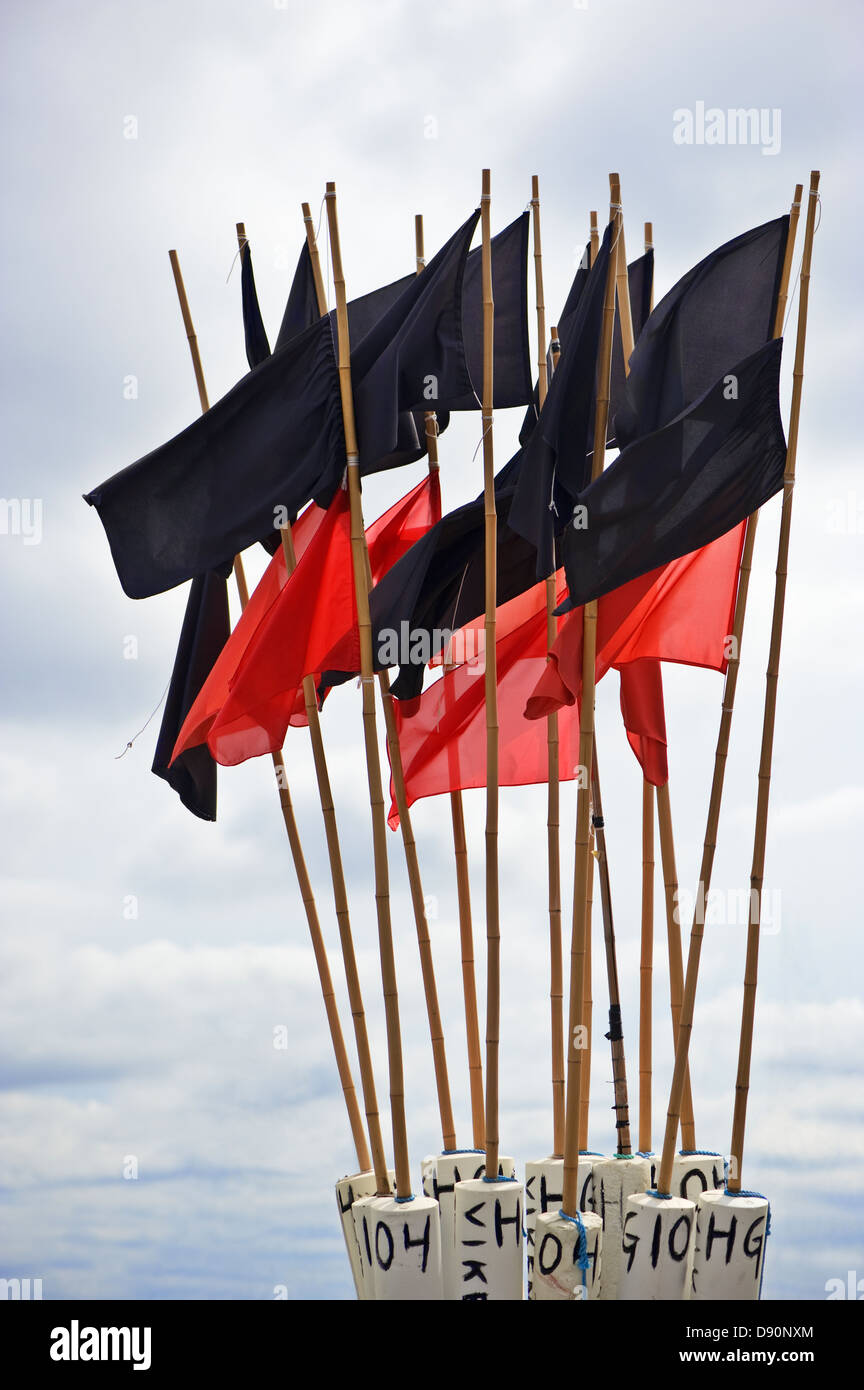 Flags flying in wind Stock Photo - Alamy