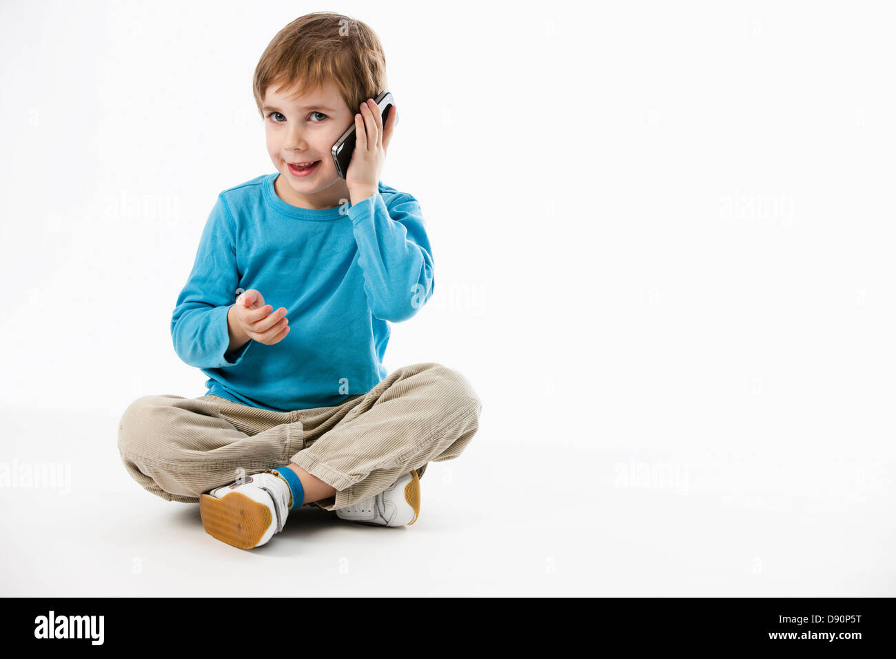 Boy talking on phone Stock Photo - Alamy