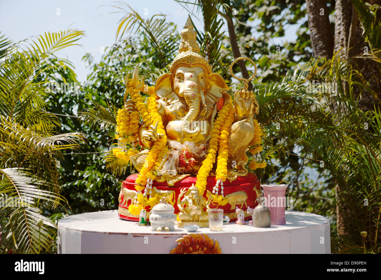 Hindu god statue in forest Stock Photo - Alamy