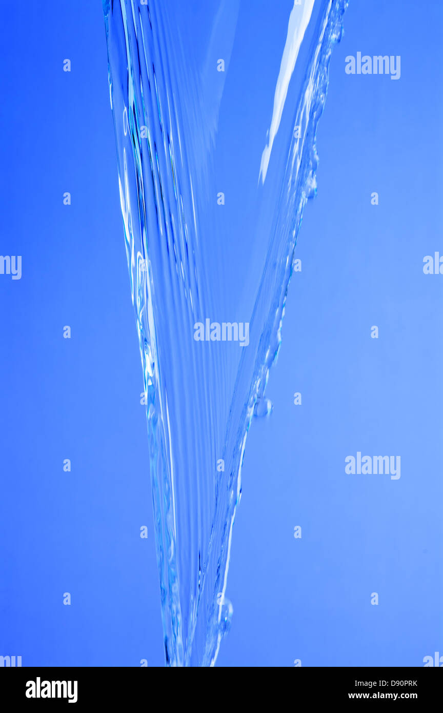 Close-up of water pouring against white background Stock Photo - Alamy