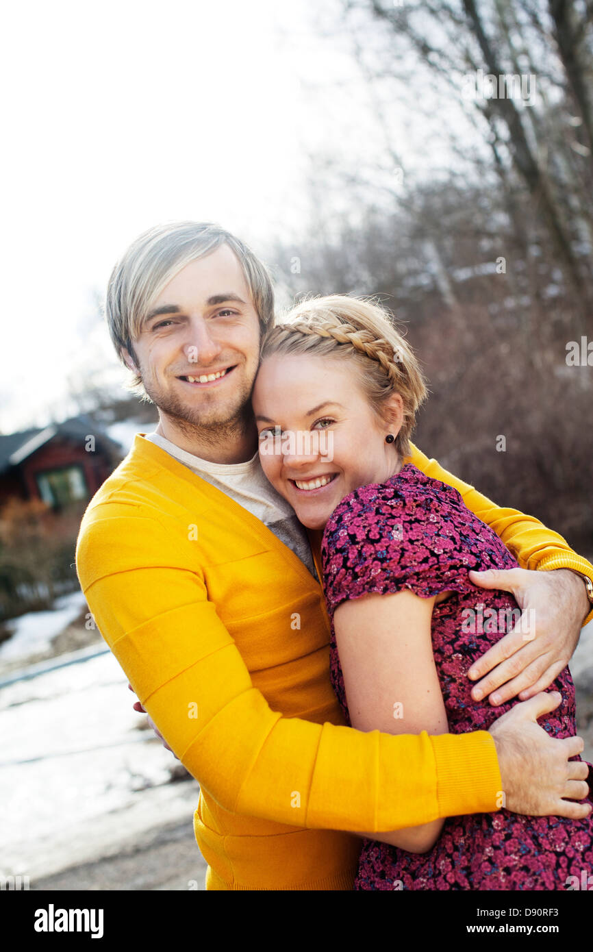 Young couple embracing Stock Photo - Alamy