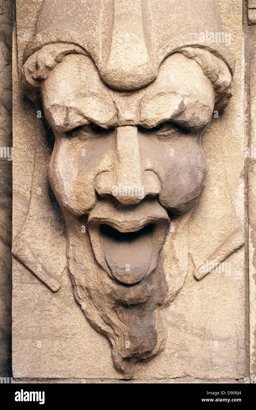 Carving of human face on stone Stock Photo - Alamy