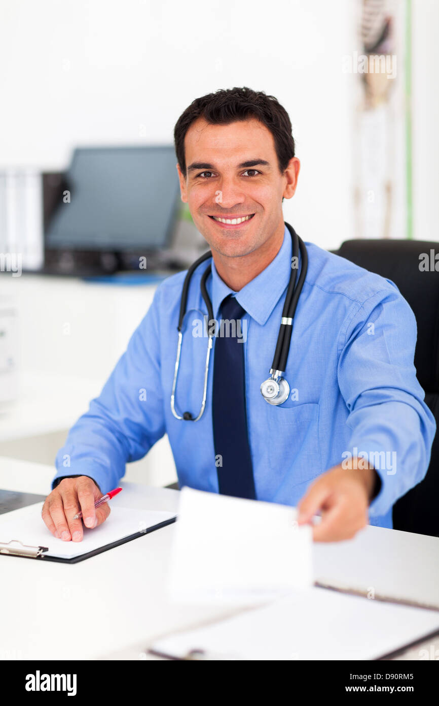 friendly medical doctor handing patient prescription Stock Photo - Alamy