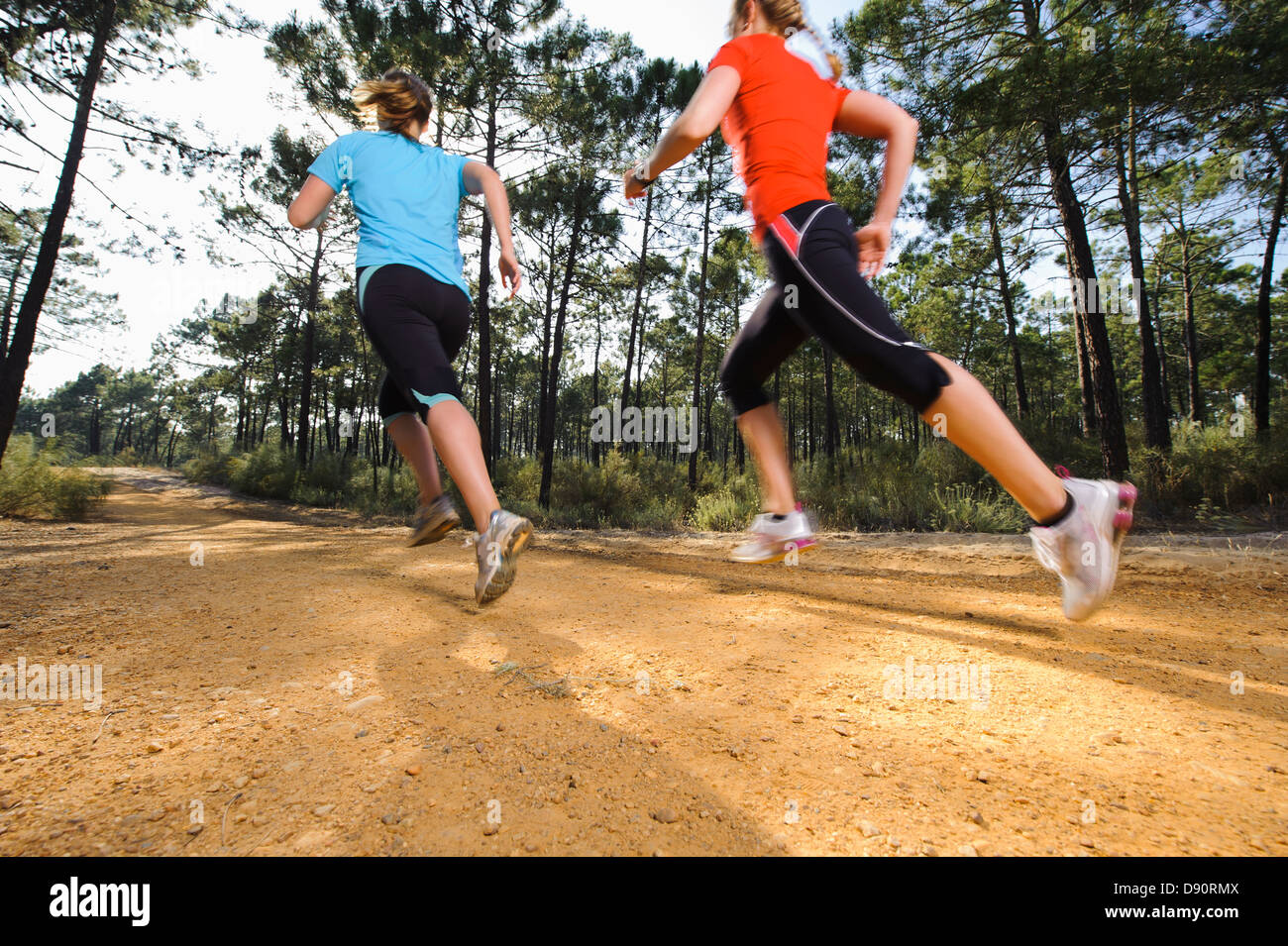 Young women jogging, low angle view Stock Photo - Alamy