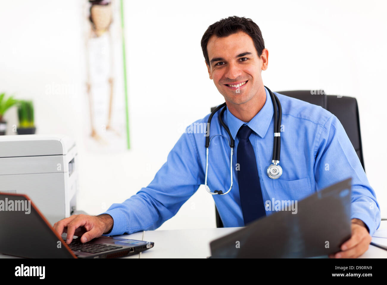 handsome medical doctor working in office Stock Photo - Alamy