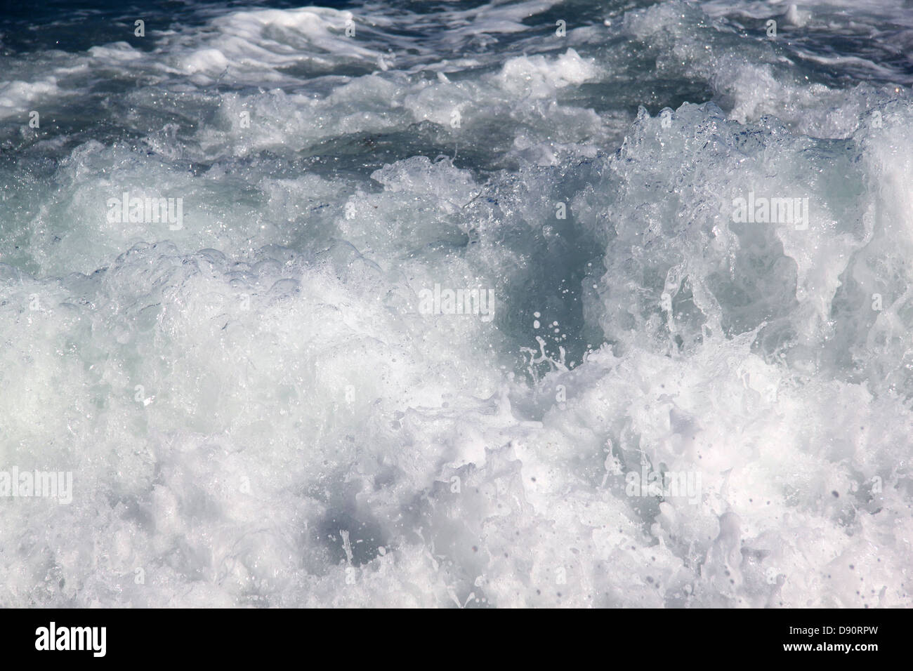 Sea foam spray wave Stock Photo - Alamy