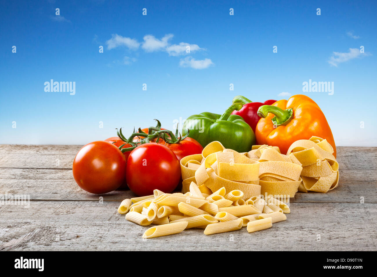 Pasta and Vegetables on Rustic Background - raw bronze die pasta and ...