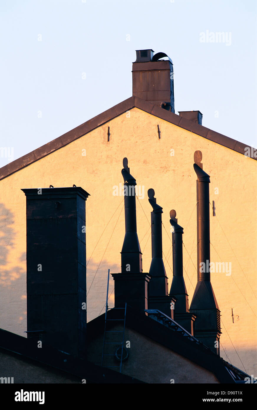 Silhouettes of chimneys atop factory Stock Photo - Alamy